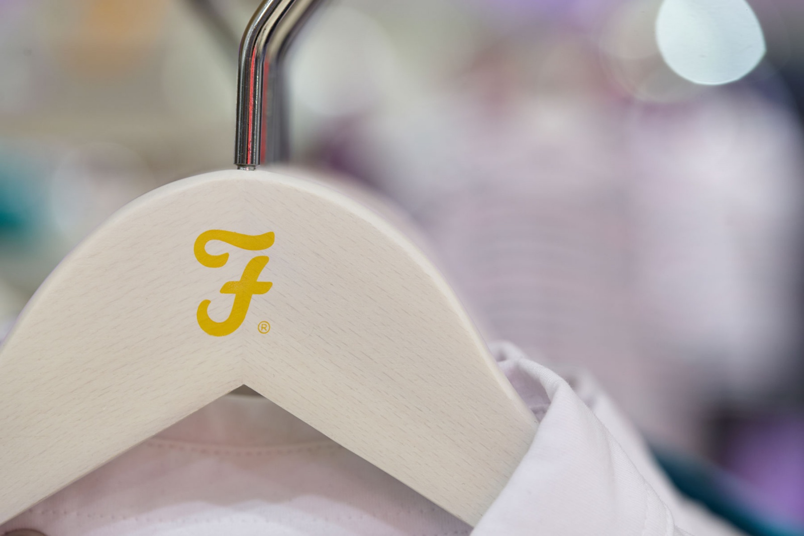Farah menswear brand rolls out new minimal logo - Design Week
